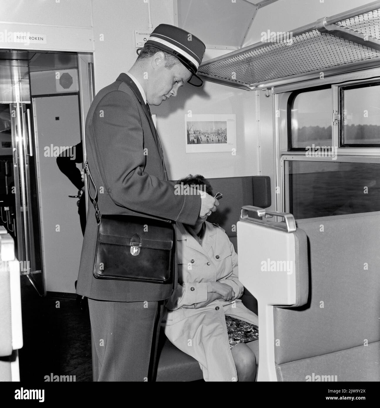 Image of a conductor of the N.S. With a new uniform, while checking the ...