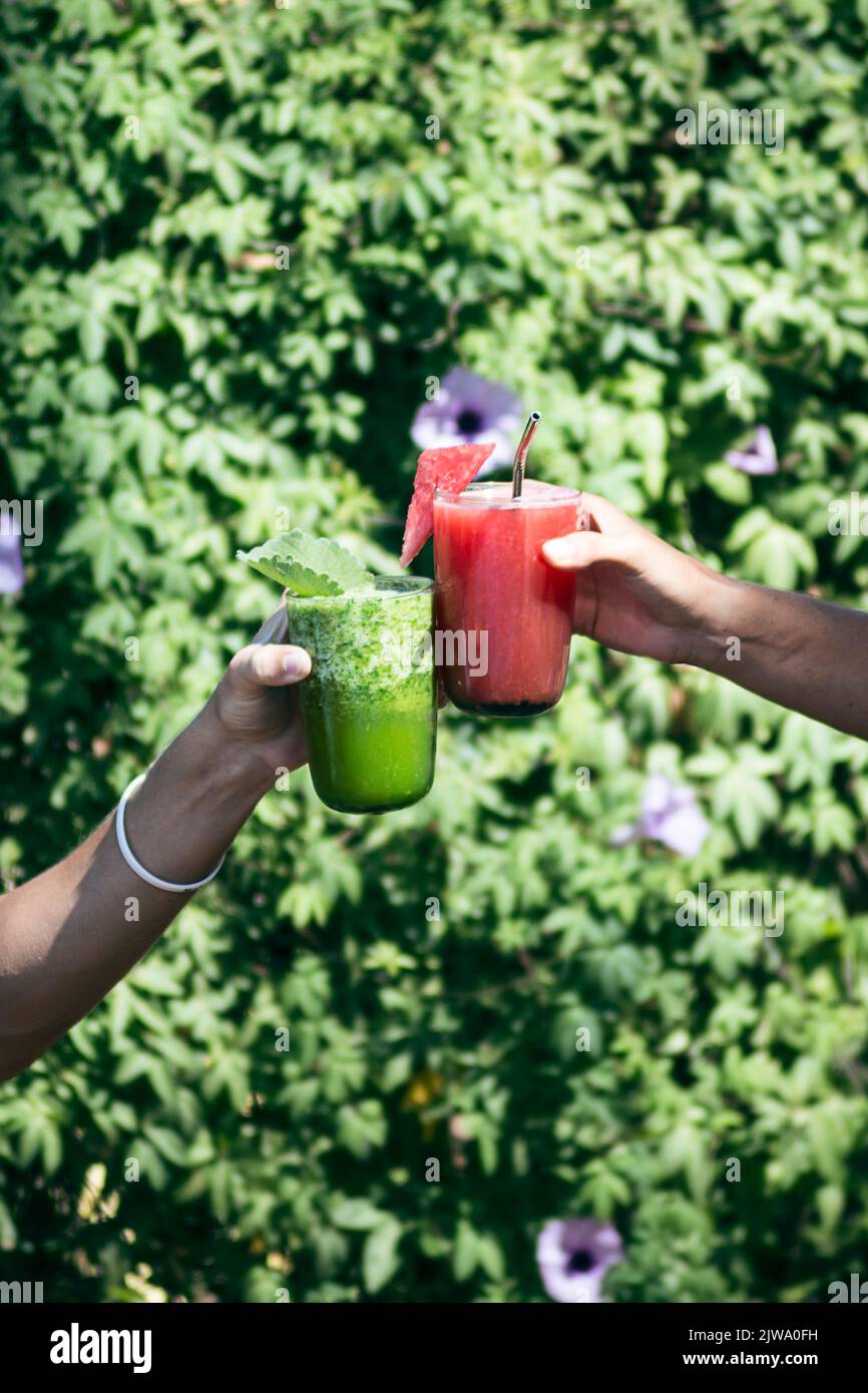 Toast with two cocktails during happy hour at a bar. Enjoying a few ...