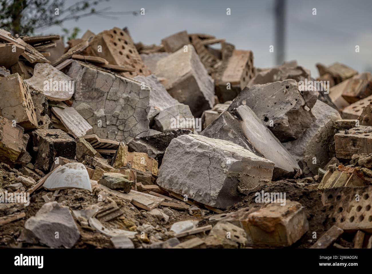 Stone dump on the ruins of a private house. A pile of construction ...
