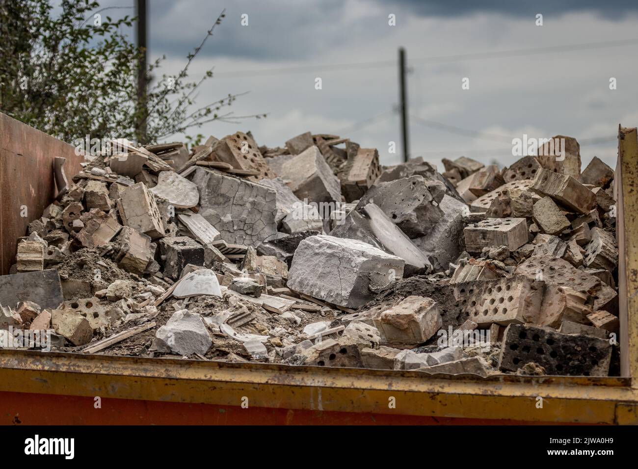Stone dump on the ruins of a private house. A pile of construction ...