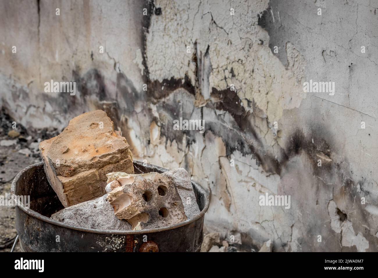 Stone dump on the ruins of a private house. A pile of construction ...