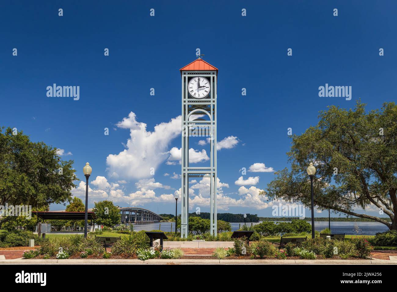 Clocktower at Riverfront Park in Palatka, Florida with the St John's River bridge in the ...