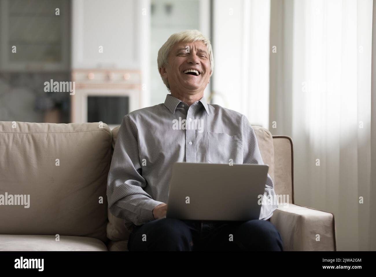Cheerful happy customer man speaking on video call Stock Photo - Alamy