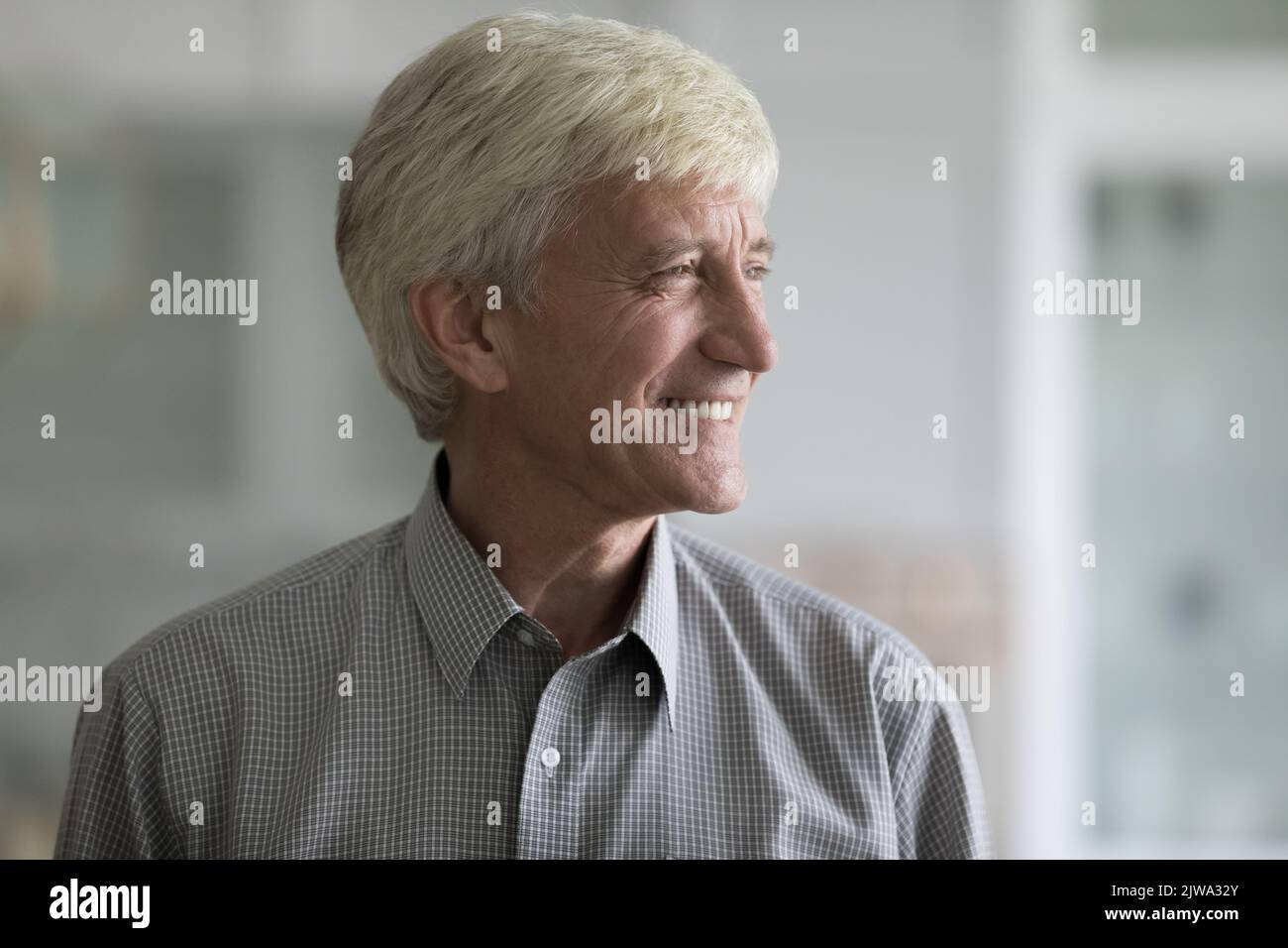 Happy dreamy handsome old retired business man looking away Stock Photo ...