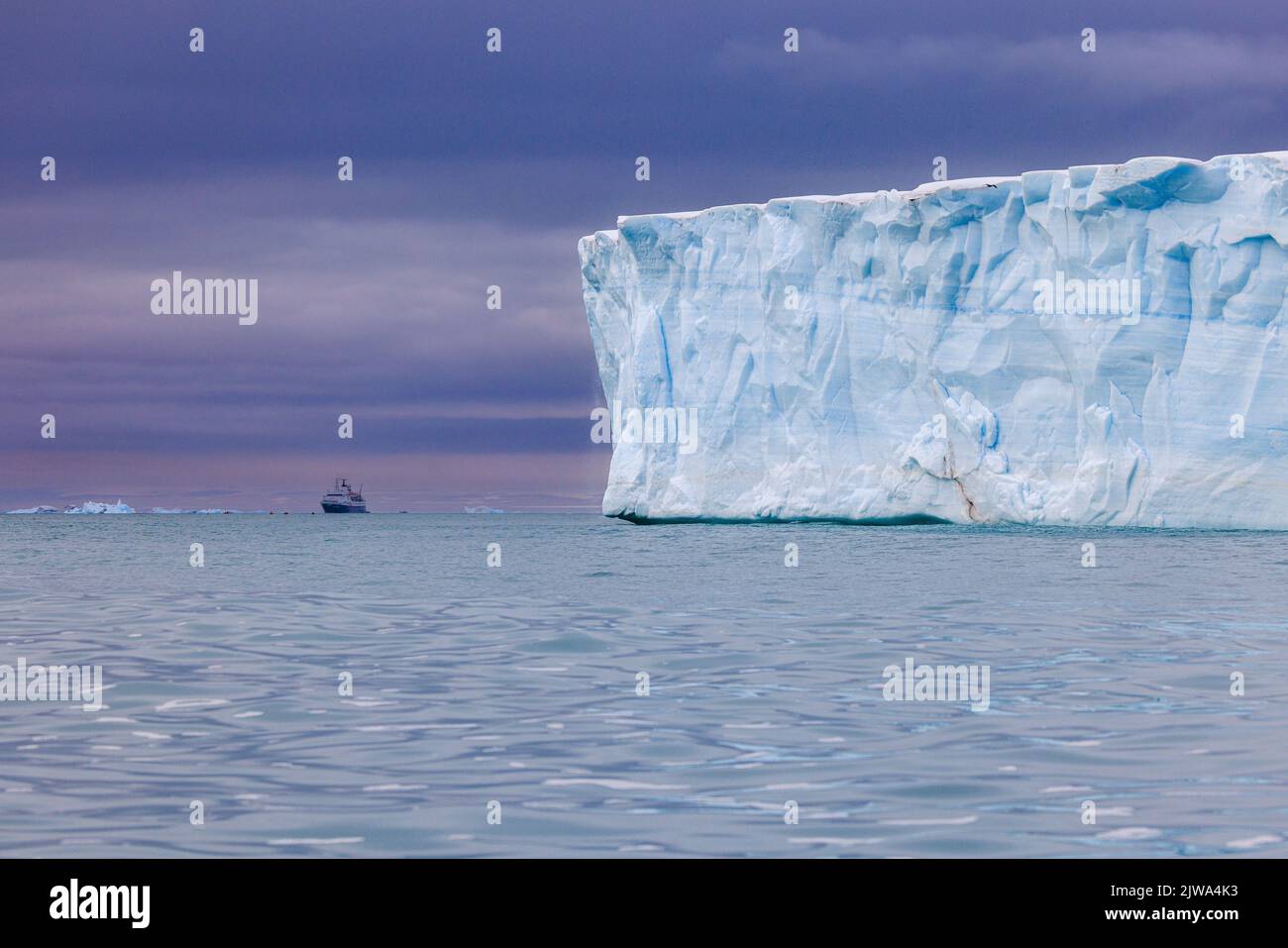 the sheer vertical wall of the massive ice cliff brasvellbreen at the ...