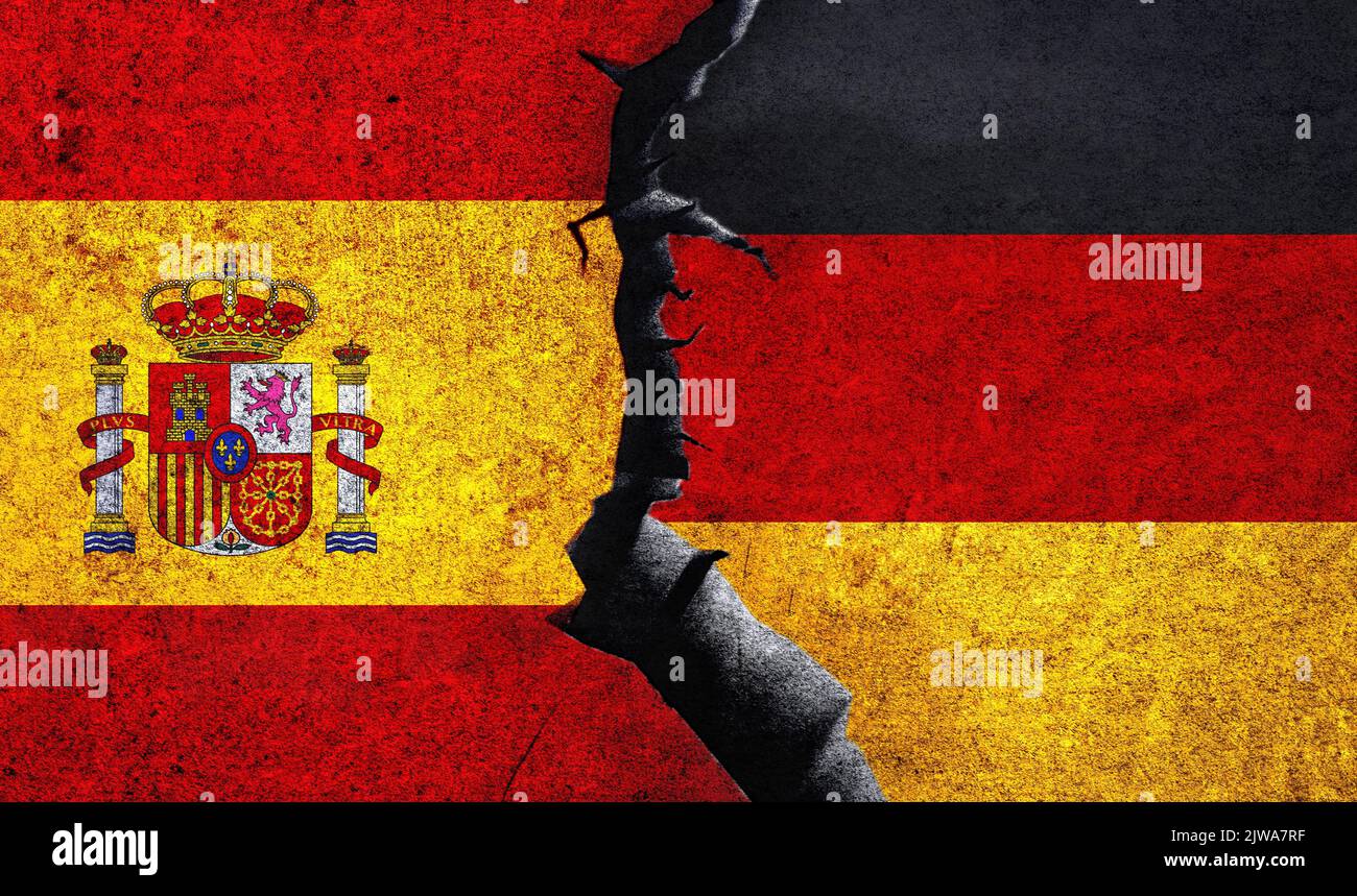 Spain vs Germany flags on a wall with a crack. Spain Germany relations ...