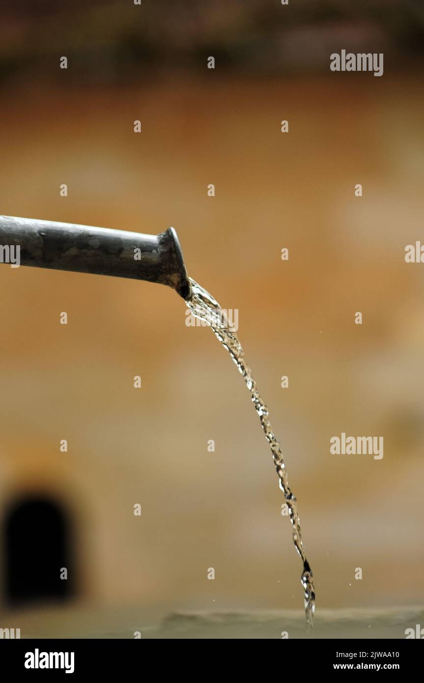 water well dropping from a water spender in a european city Stock Photo ...