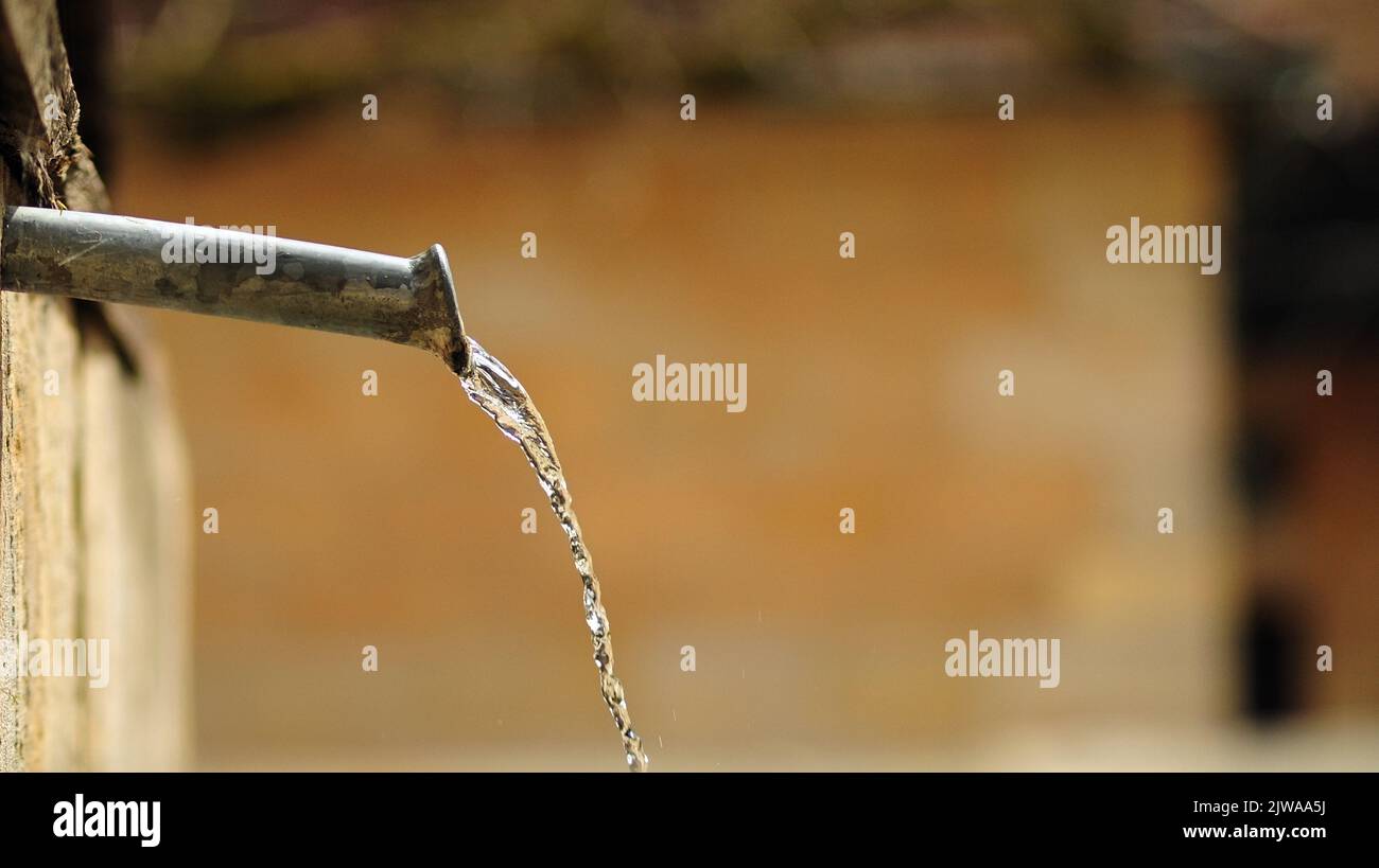 water well dropping from a water spender in a european city Stock Photo ...
