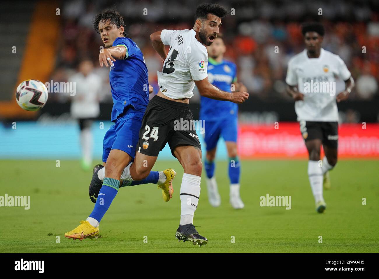 Eray Comert of Valencia CF and Enes Unal of Getafe CF during the La Liga match between Valencia ...