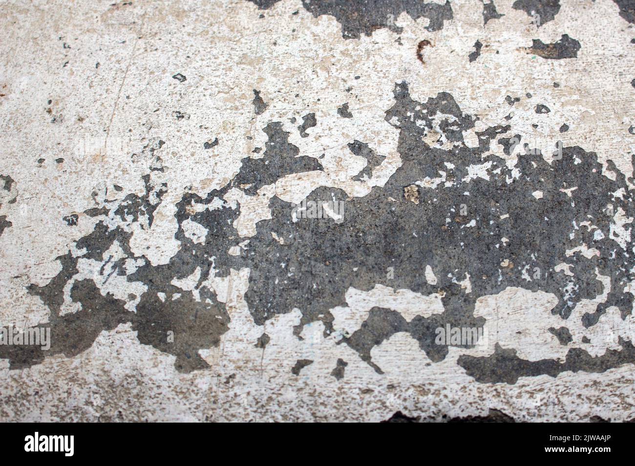 Abstract grey texture of an old concrete wall with rough cracks and ...