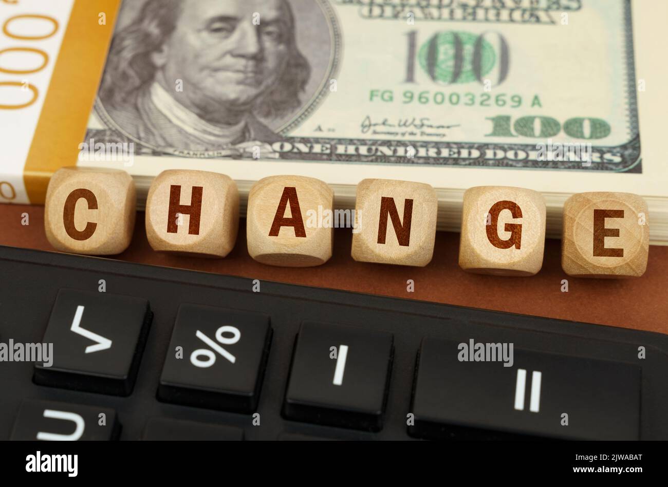 Next to the calculator and dollars are cubes with the inscription ...