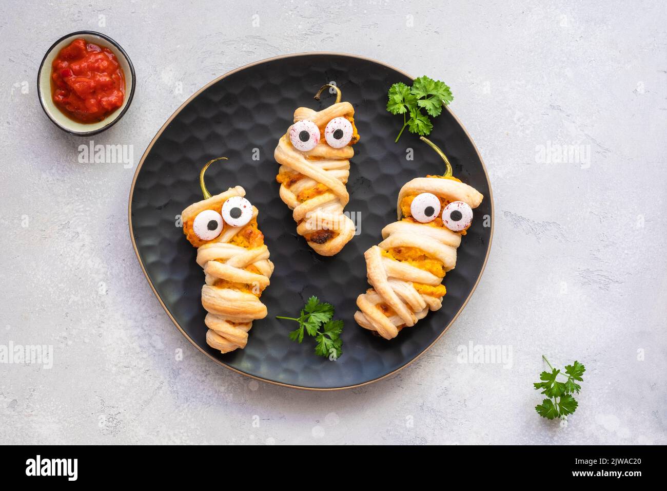 Stuffed peppers look like a mummies for Halloween Stock Photo - Alamy