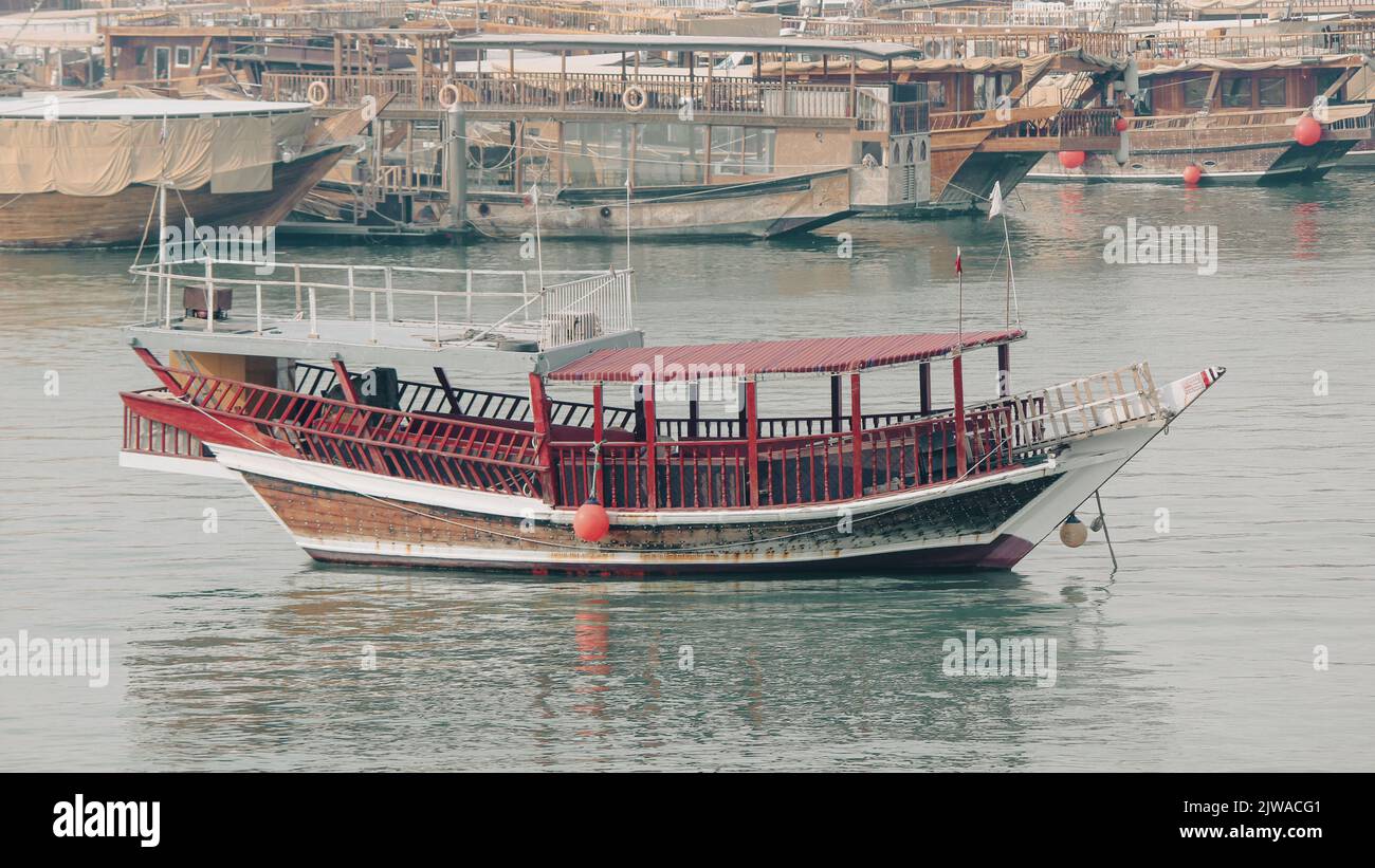 Traditional Fishing boats called dhow at the Qatar Corniche Stock Photo ...