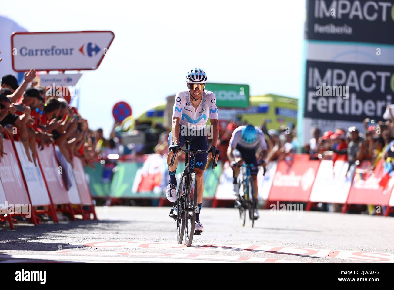Spanish Enric Mas of Movistar Team crosses the finish line of stage 15 ...
