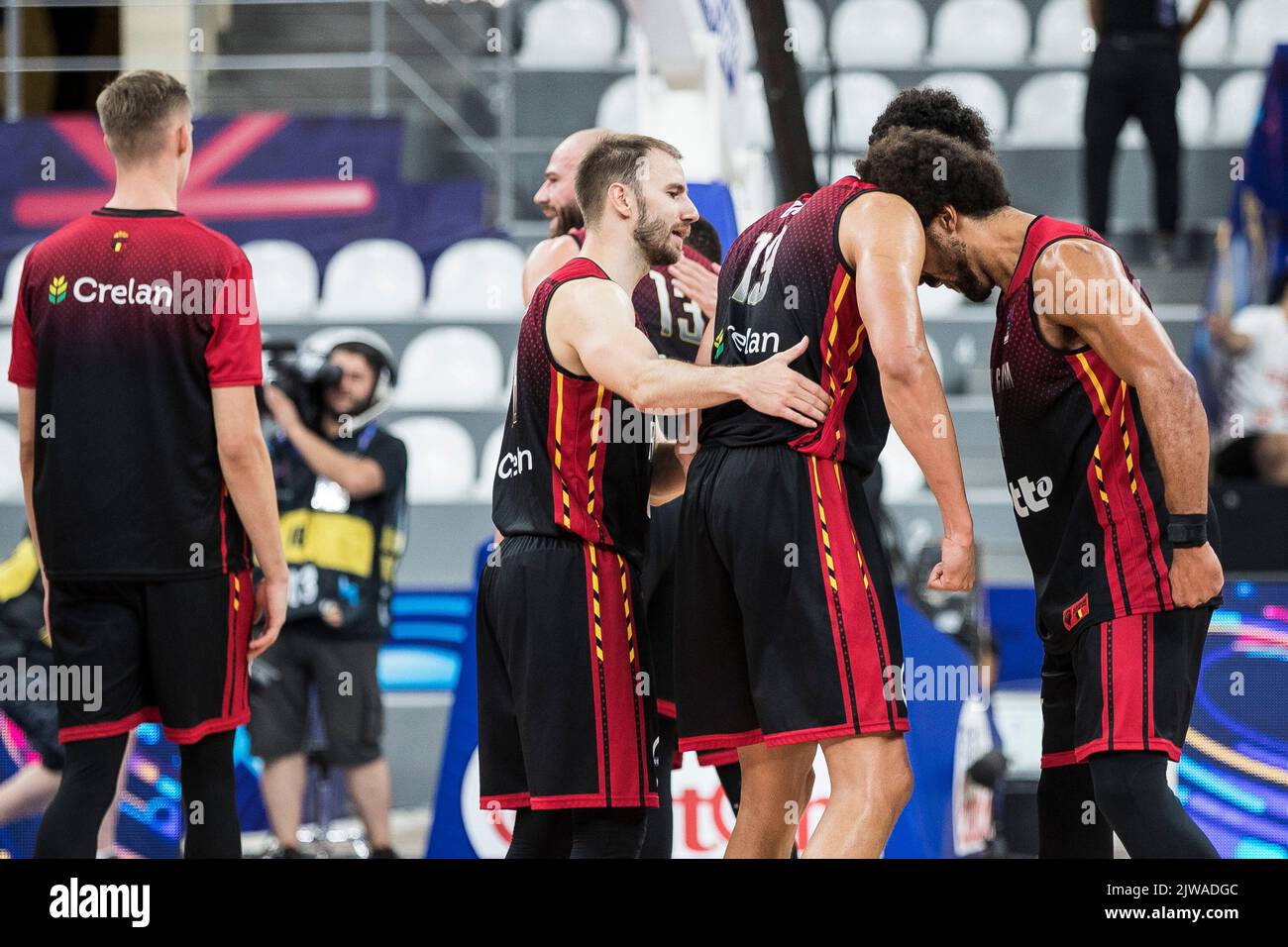 Belgium's players celebrate after winning the match between Spain and ...