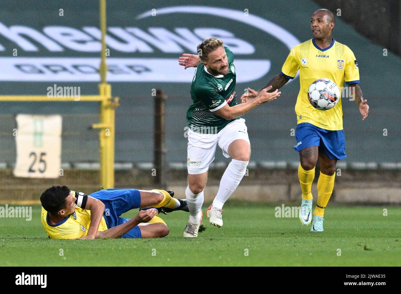 Beveren's Kevin Hoggas and Lommel's Robin Henkens fight for the ball ...