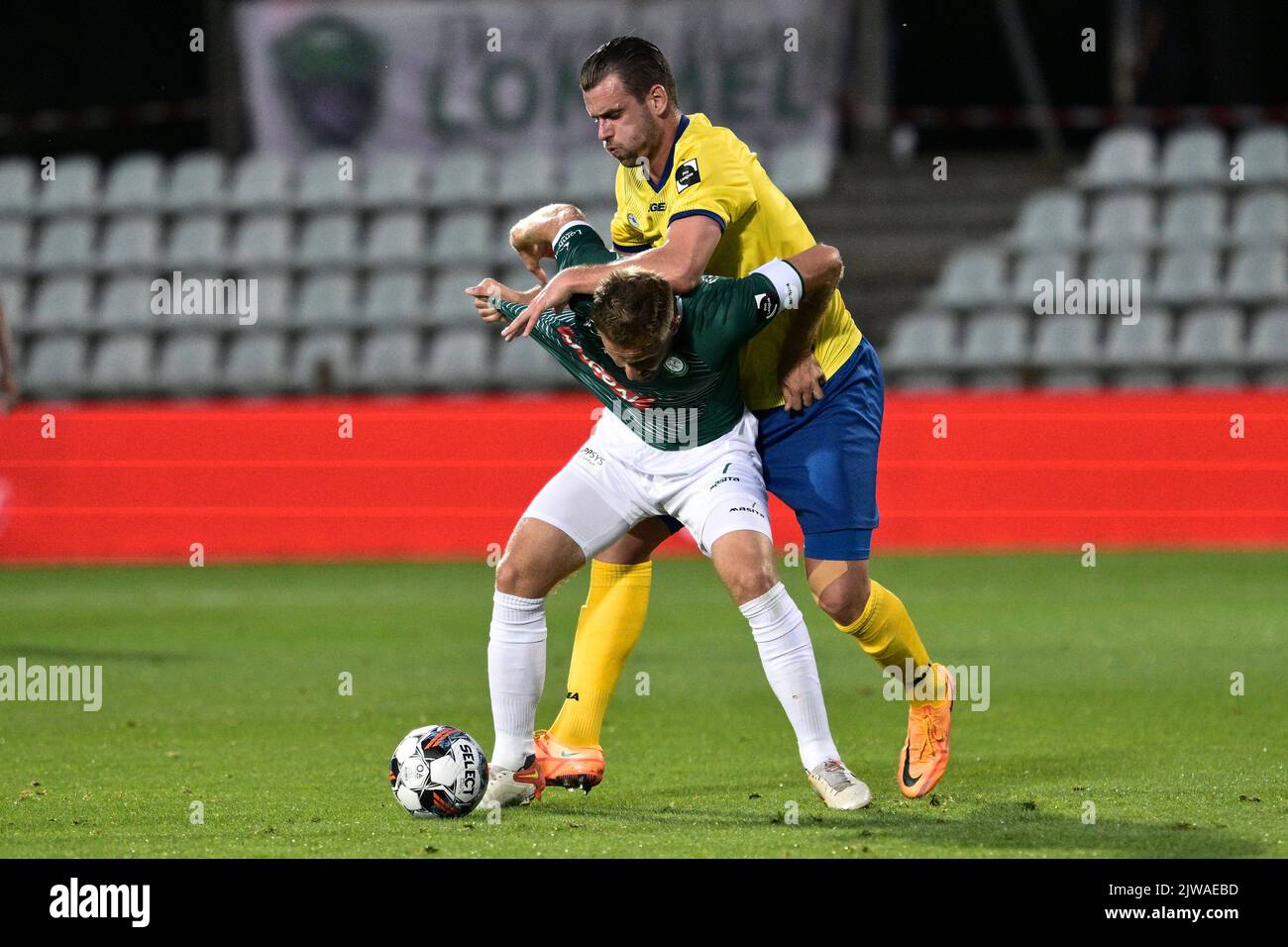 Lommel's Robin Henkens and Beveren's Joachim Van Damme fight for the ...