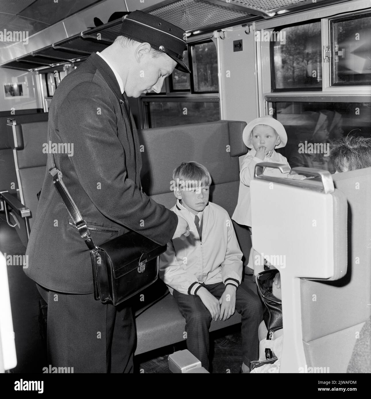 Image of a conductor of the N.S. With a new uniform, while checking the ...