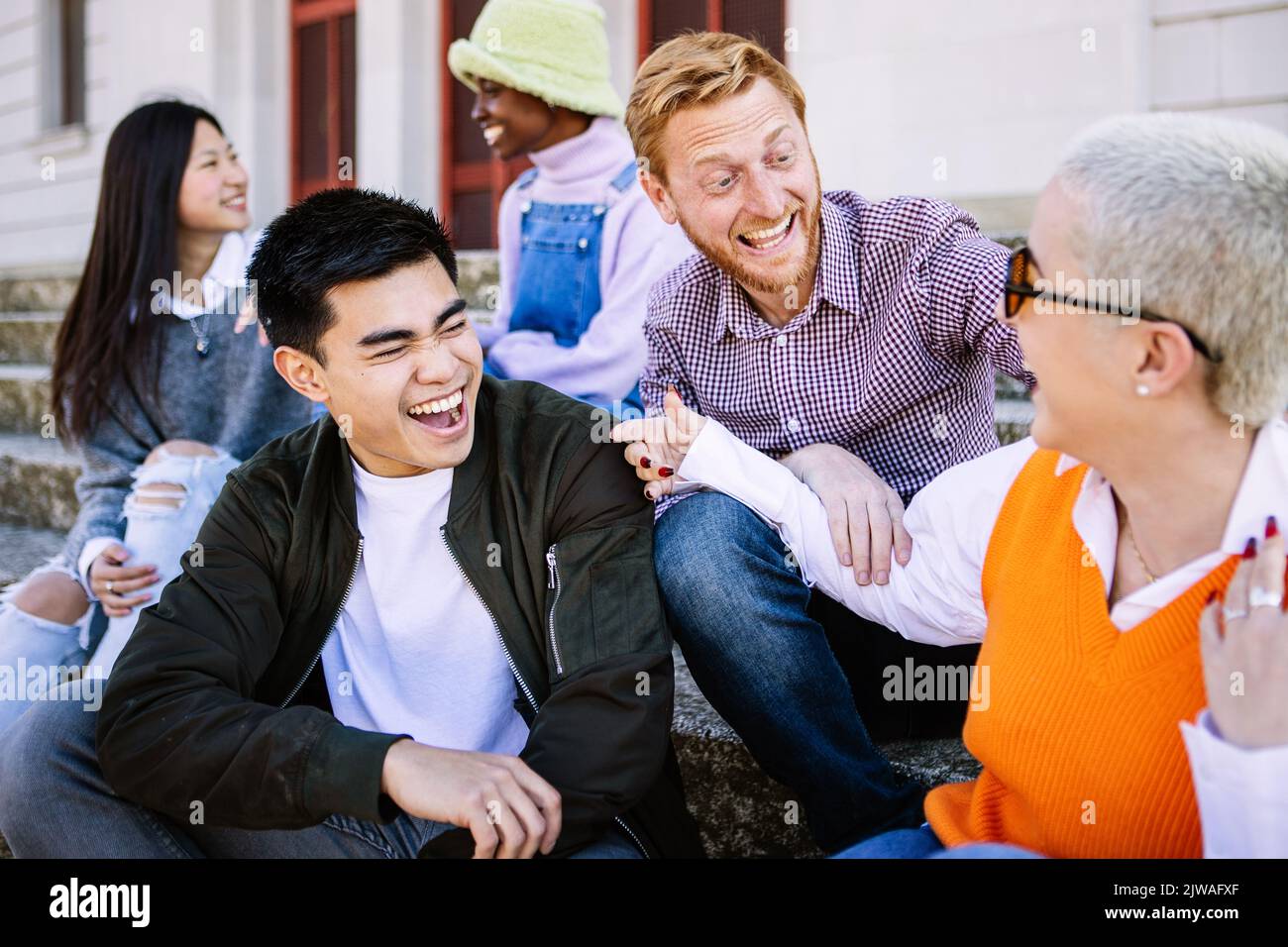 Happy young group of millennial friends having fun outdoors Stock Photo ...