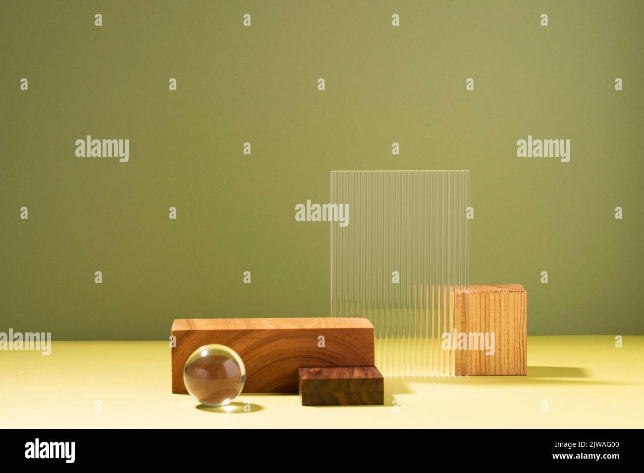 Creative abstract podium made of wooden figures and glass, dark green ...