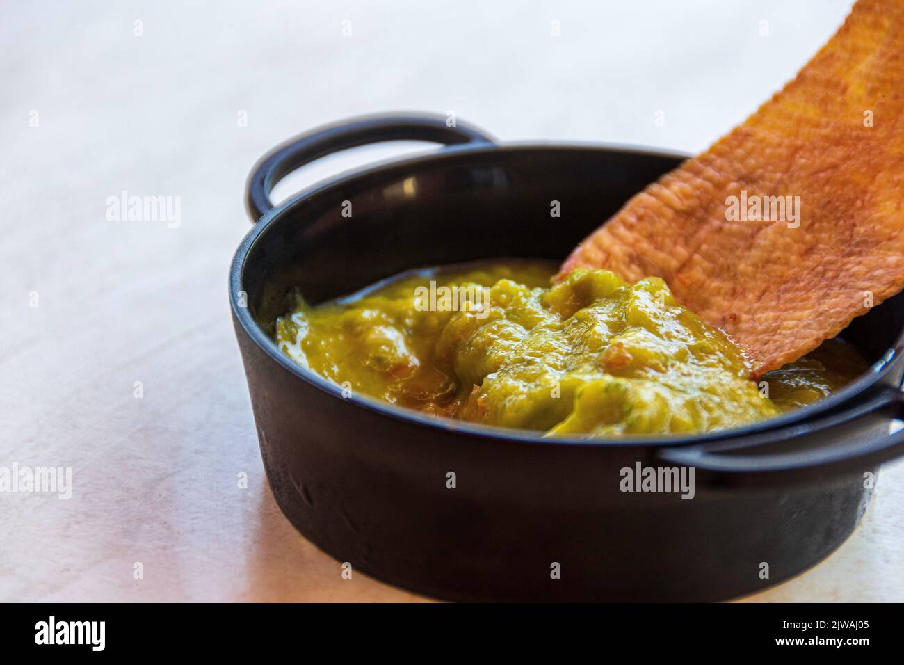 Guacamole dip in black hi-res stock photography and images - Alamy