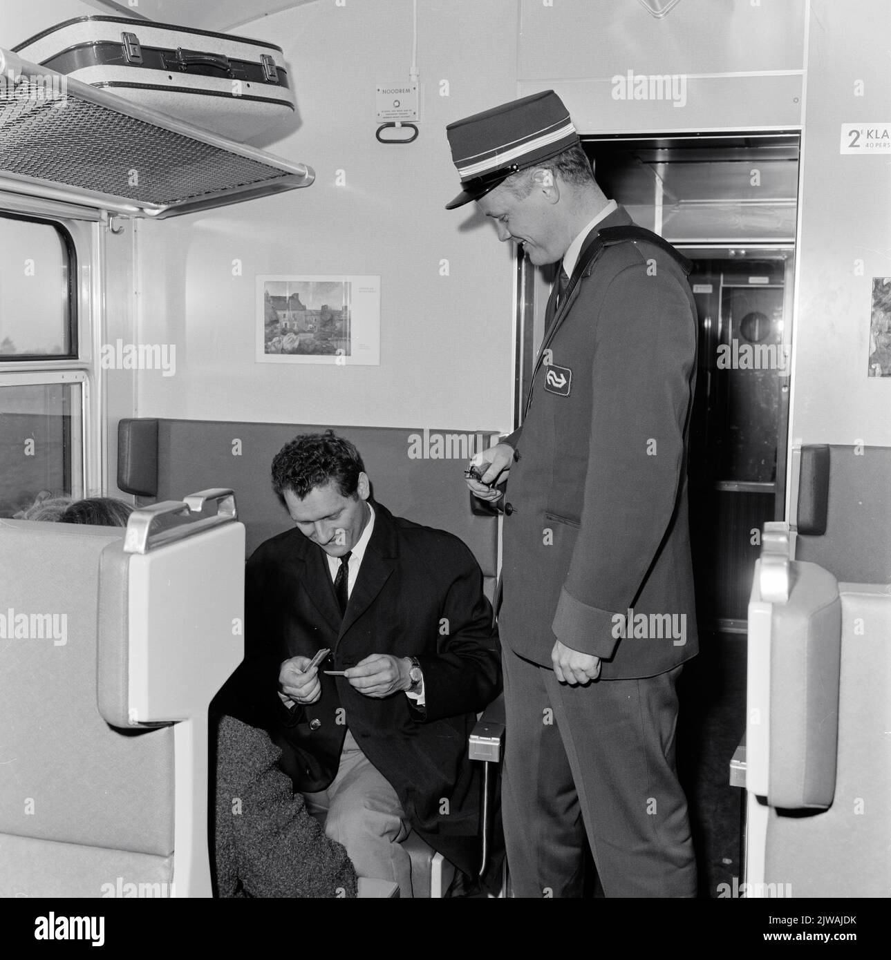 Image of a conductor of the N.S. With a new uniform, while checking the ...