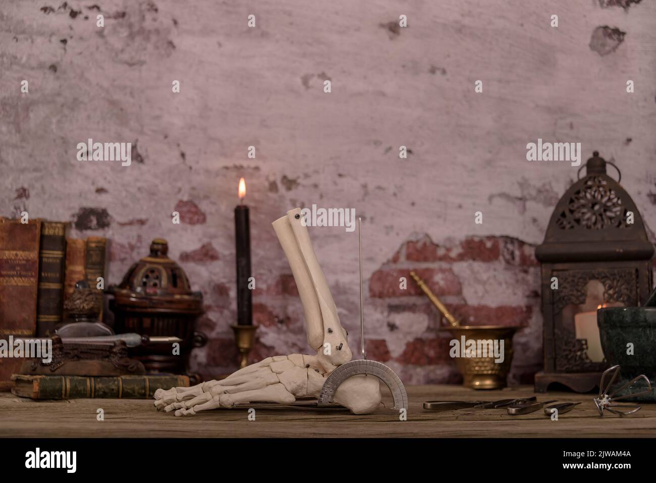 Old doctor's desk. still life of instruments and bone parts typical of ...
