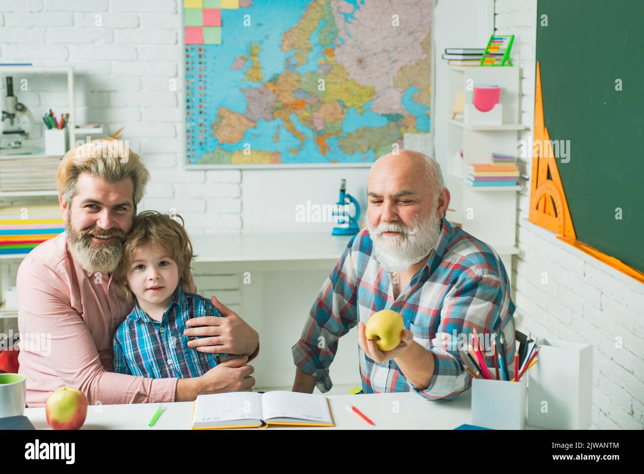 School, teacher and child learn. Father and son with grandfather back ...