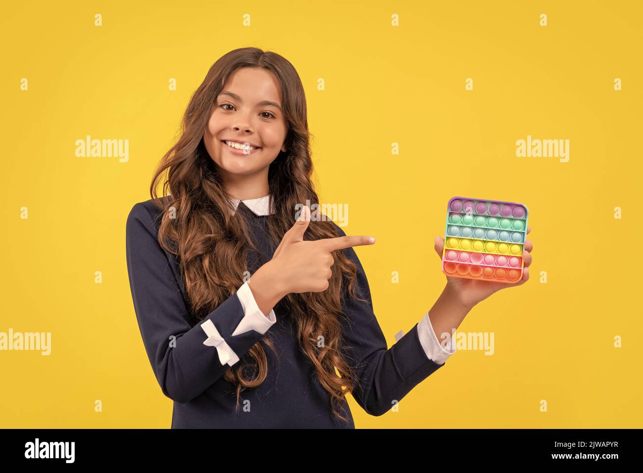 happy child point finger on popit silicone sensory fidget game, pop it ...