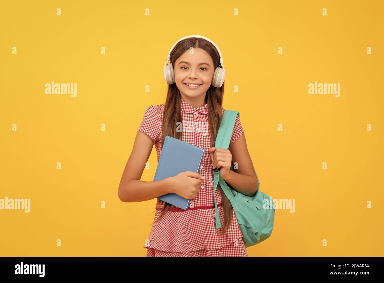 happy childhood. child with school bag. music. happy teen girl carry ...