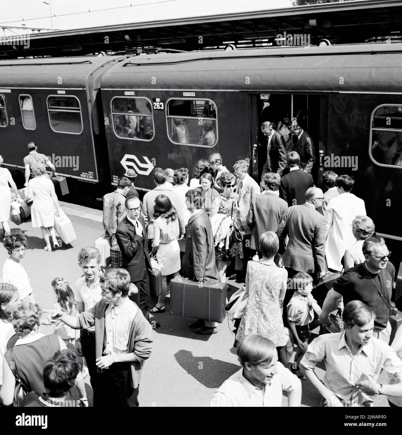 Image of crowds with train travelers when entering and getting out at ...