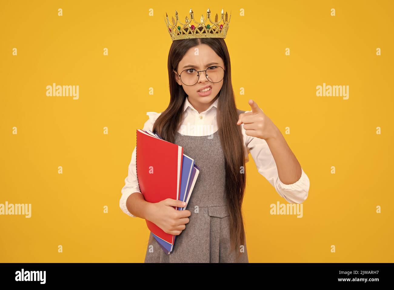 Schoolgirl nerd princess in school uniform and crown celebrating ...