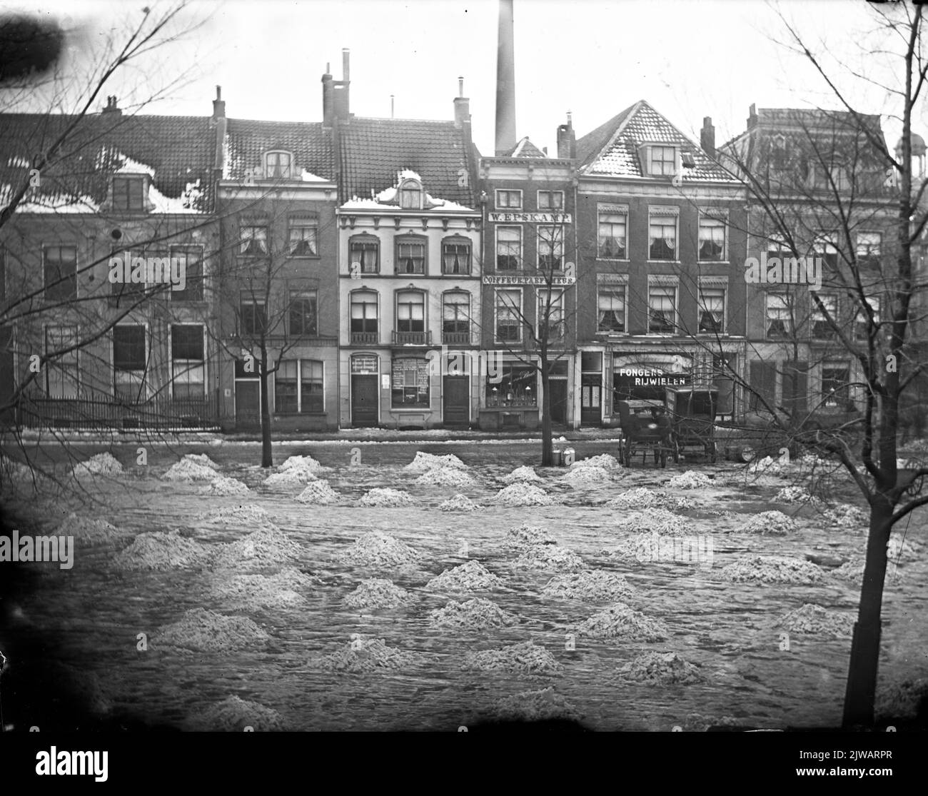 View of the Neude in Utrecht with snow heaps peeed together; In the ...