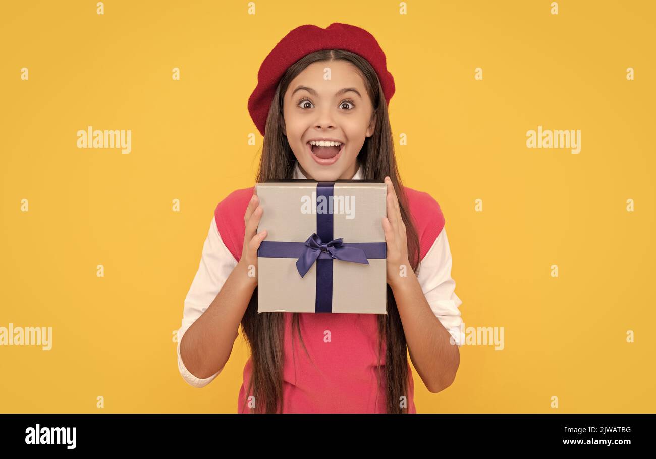 childhood happiness. boxing day. cheerful kid in beret. surprised child ...