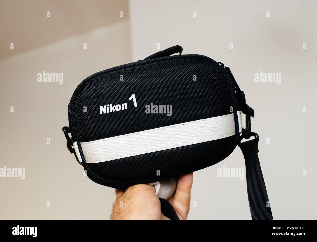 Paris, France - Jul 16, 2022: POV male hand holding Nikon 1 camera bag for the now defunct ...