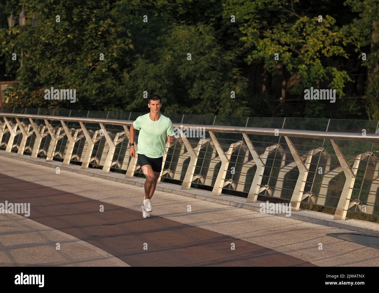 athletic man jogger running in sportswear outdoor Stock Photo - Alamy
