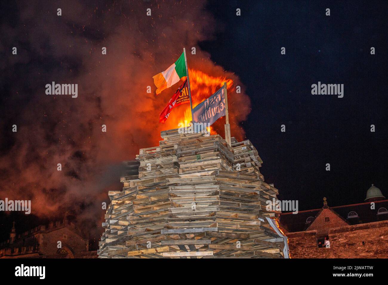 Burning Irish flag at Loyalist bonfire in the protestant Fountain ...