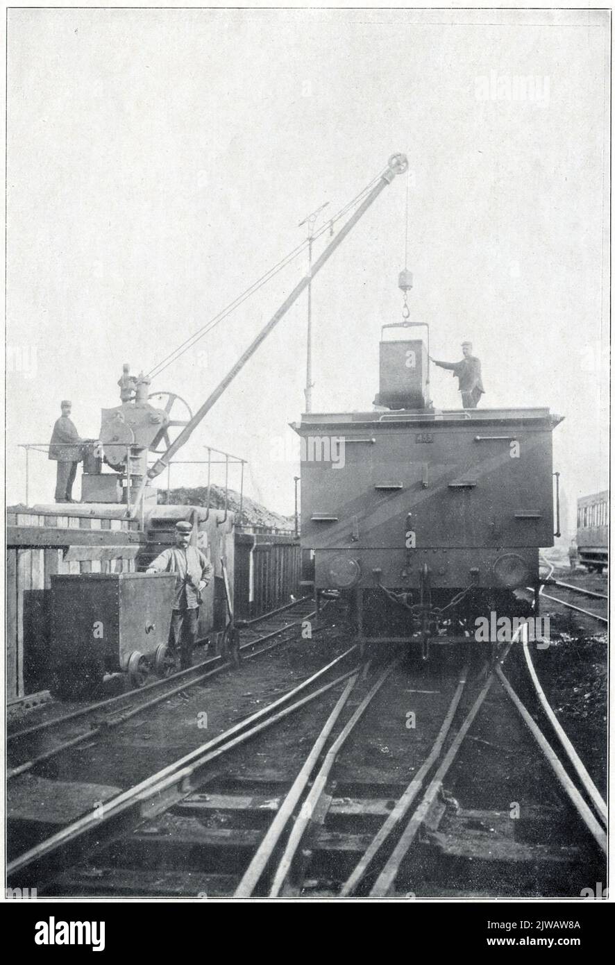 Image of the loading of a steam locomotive with coal using an electric ...