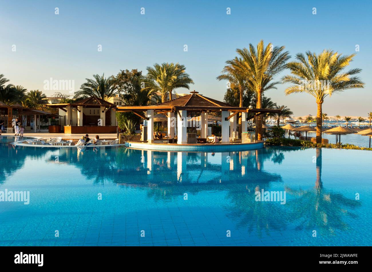 A turquoise blue pool and bar of a Red Sea resort hotel in Hurgada ...
