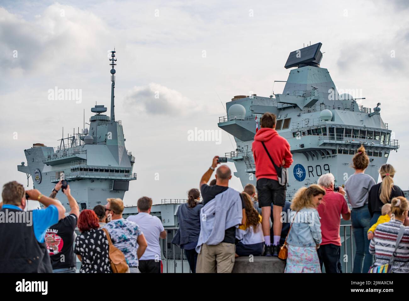 HMS Prince of Wales (R09) passing people gathered on the Round Tower at ...