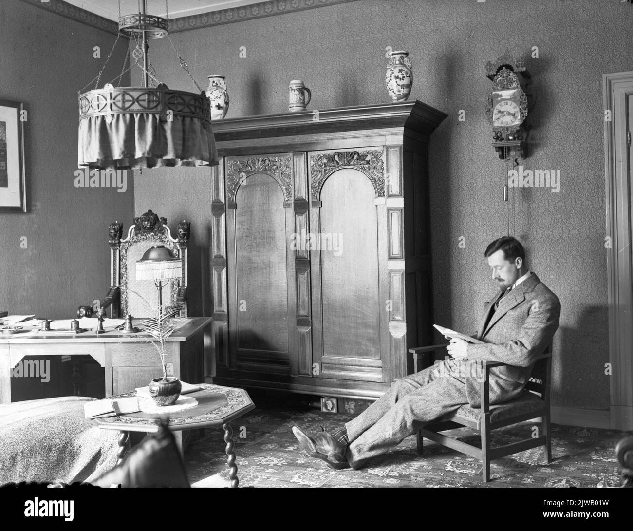 Interior of an unknown house in Utrecht, with a reading man Stock Photo ...