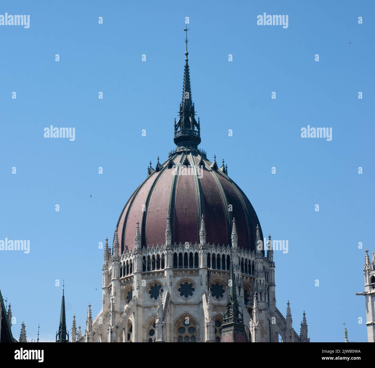 See the beautiful red roof dome of the Parliament House in Budapest ...