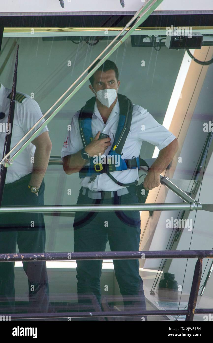 The captain and team alonside the local pilot on the bridge of Royal ...