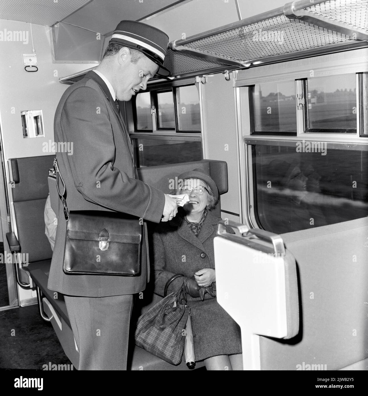 Image of a conductor of the N.S. With a new uniform, while checking the ...