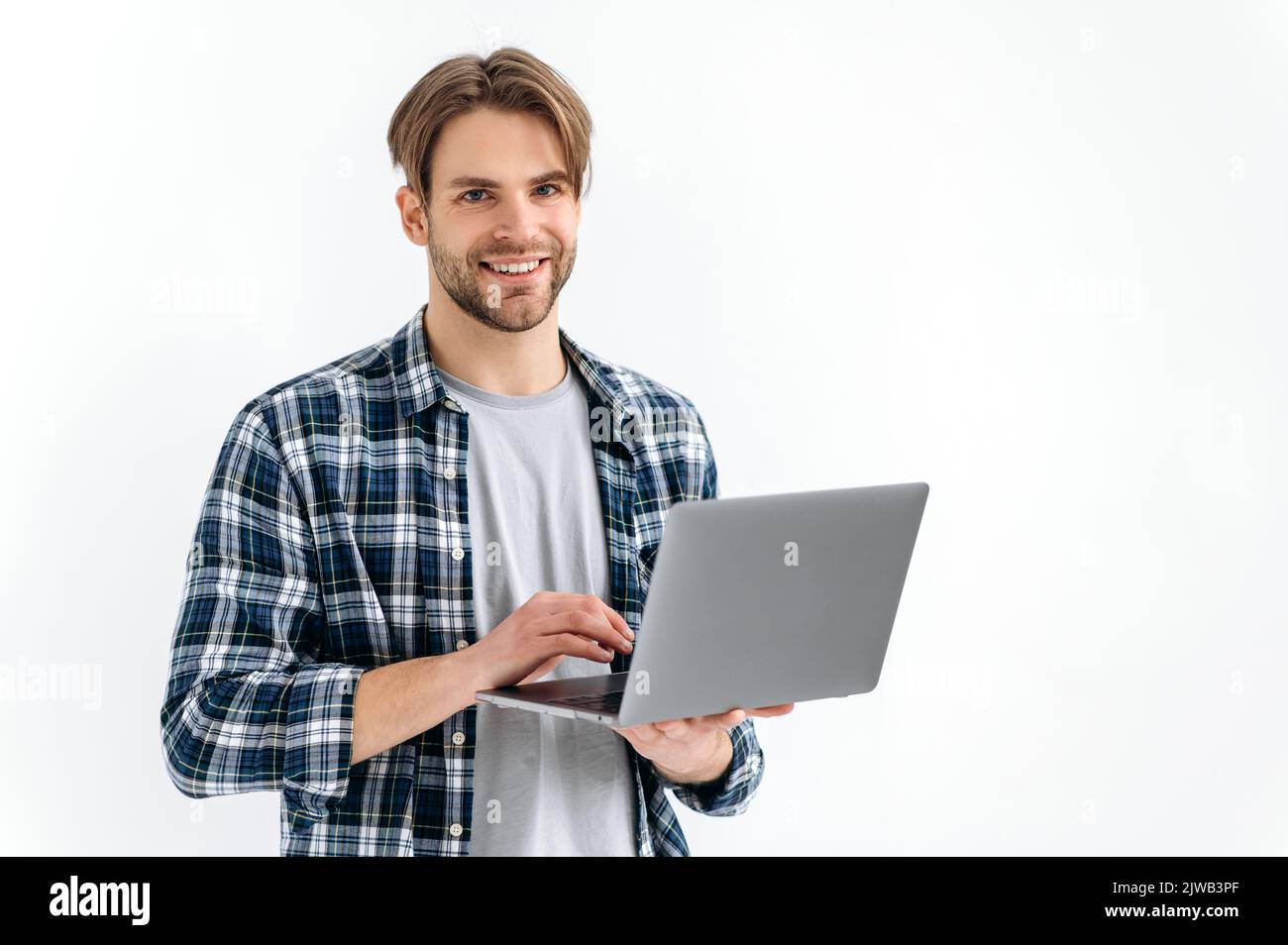 Positive handsome confident caucasian stylish young man, freelancer ...