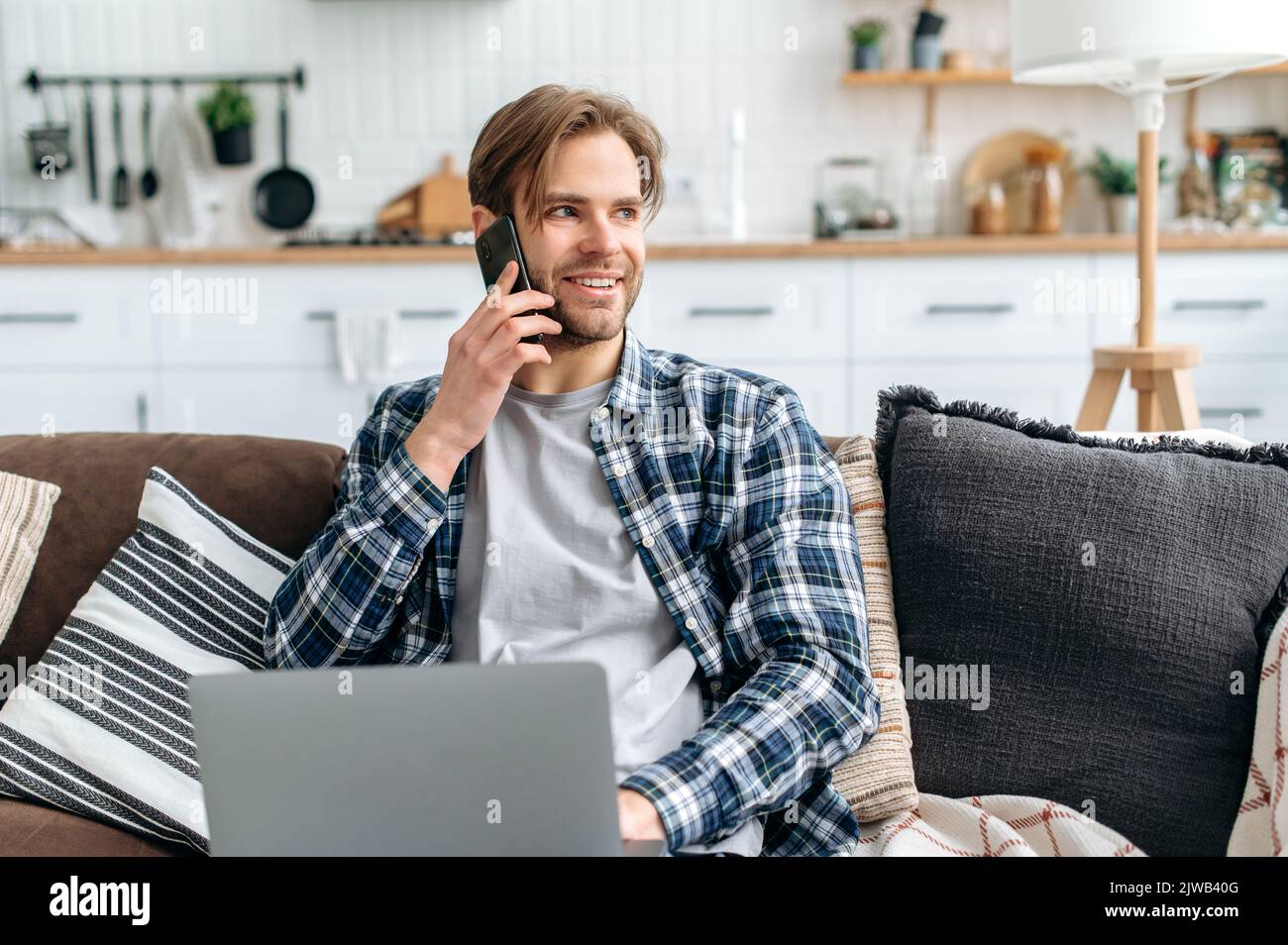 Handsome man looks happy talking hi-res stock photography and images ...