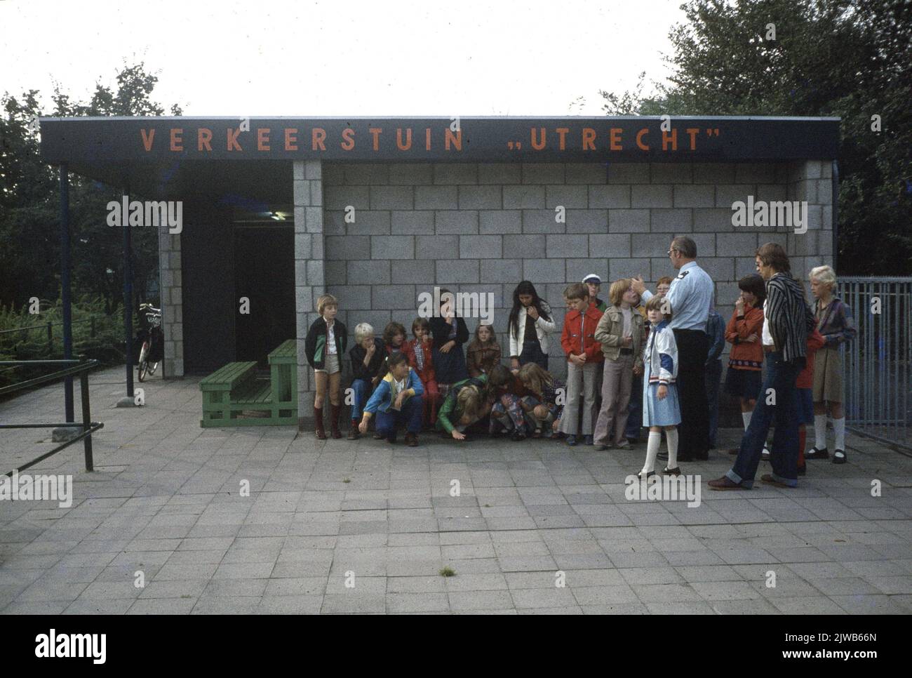 Image of a group of school children and an agent at the reception ...
