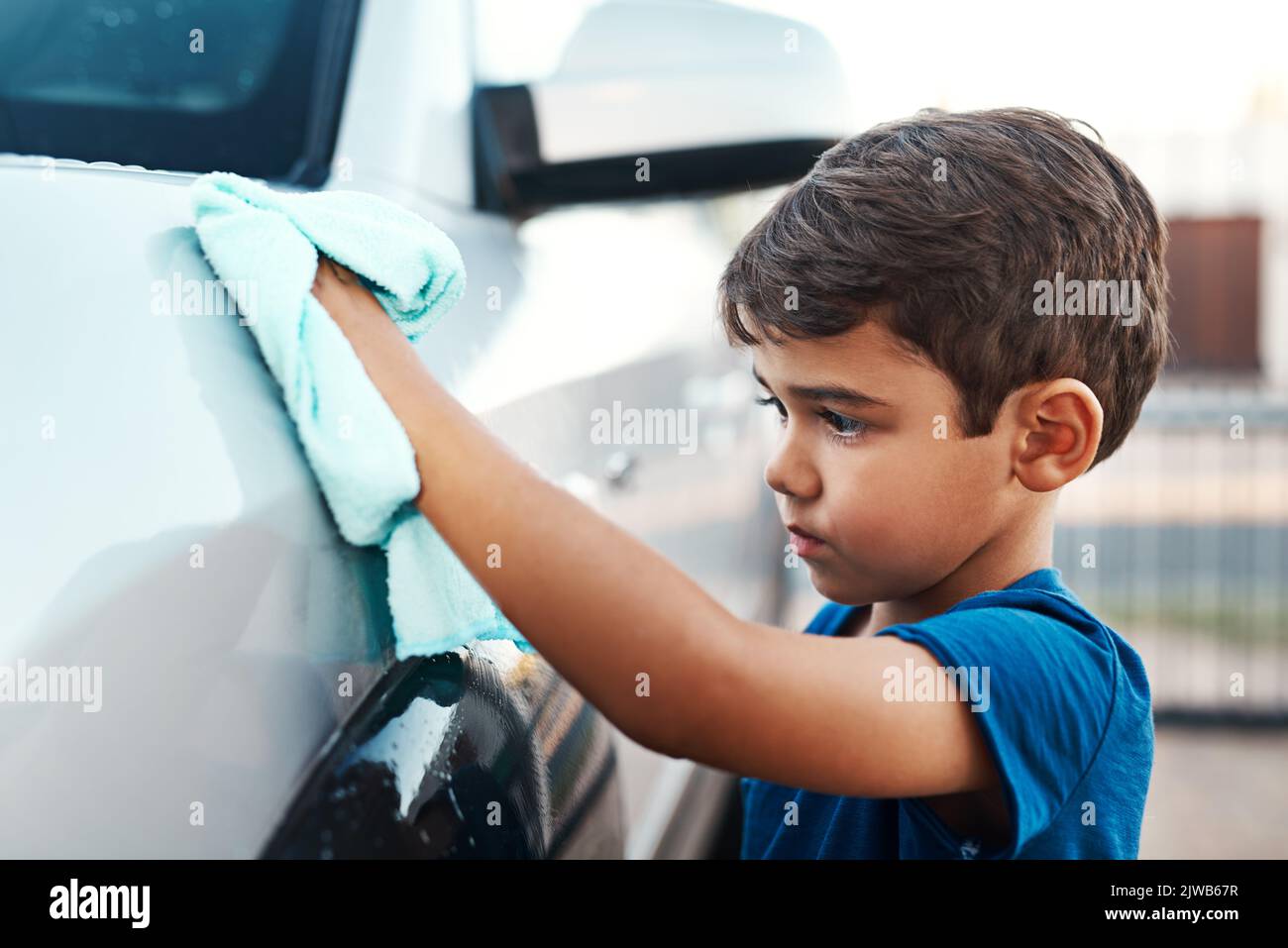 Boy washing car hi-res stock photography and images - Alamy