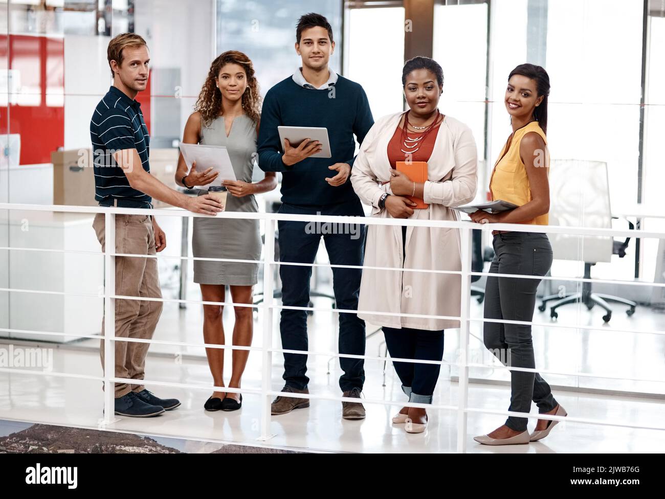 Standing strong for our dreams. Full length shot of a diverse group of ...