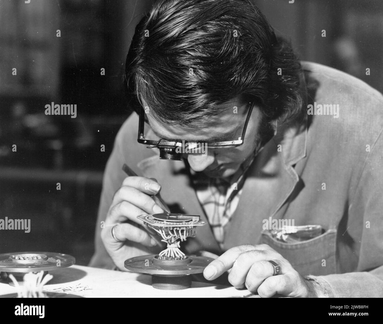 Image of an instrument maker in the main workshop of the N.S. in ...